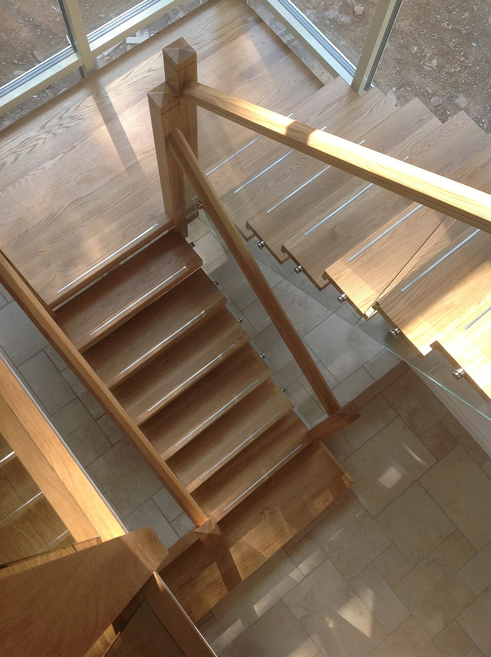 Custom built oak and steel spine stairs - Design and Fitting in Ireland