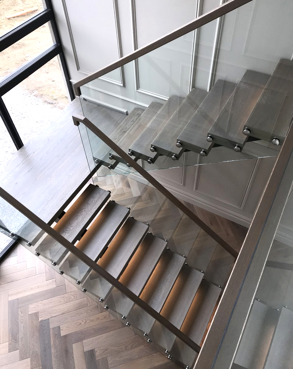 Self-Supporting Matte Black Steel Spine Stairs | AJD Stairs – Cork City ...