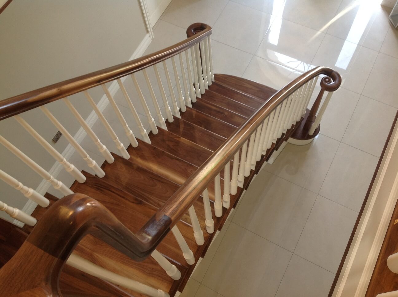 Flared Concrete Staircase with Walnut Detailing & Curved Panelling ...
