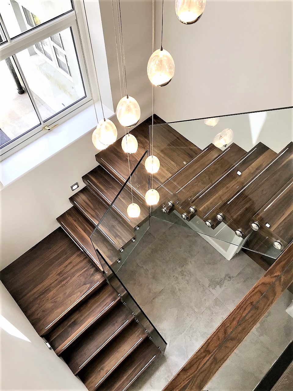 Floating Walnut Staircase with LED Lighting & Glass Balustrade ...