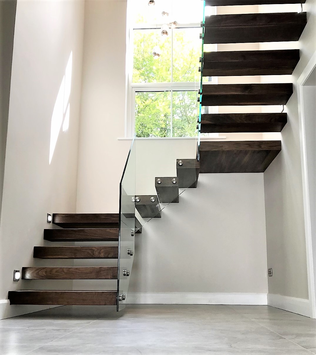 Floating Walnut Staircase with LED Lighting & Glass Balustrade ...