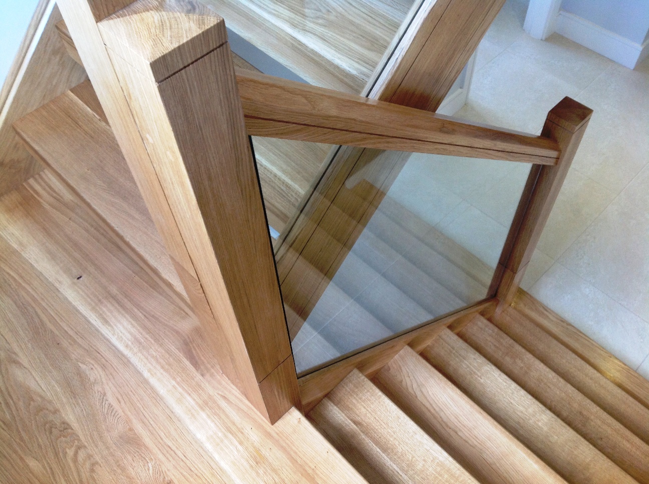 European oak open rise stairs with inset glass balustrades