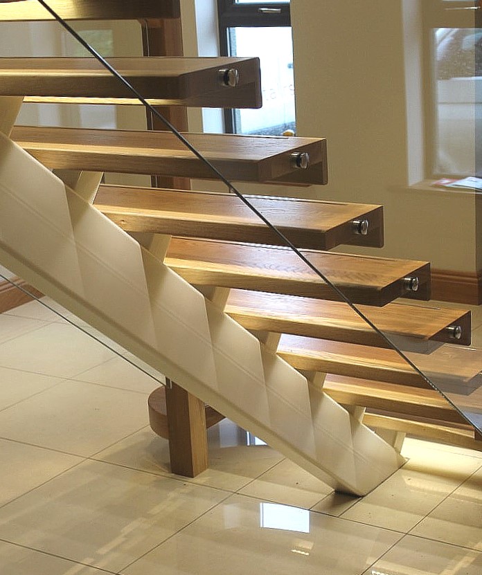 Steel spine stairs with American oak treads, newels, handrail and inset ...